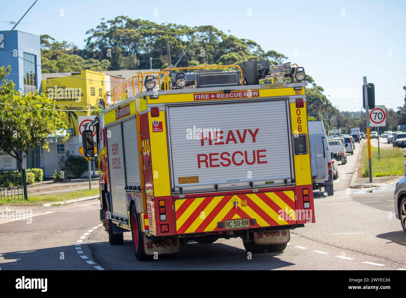 Australia, Fire and Rescue fire engine driving along Pittwater Road in ...