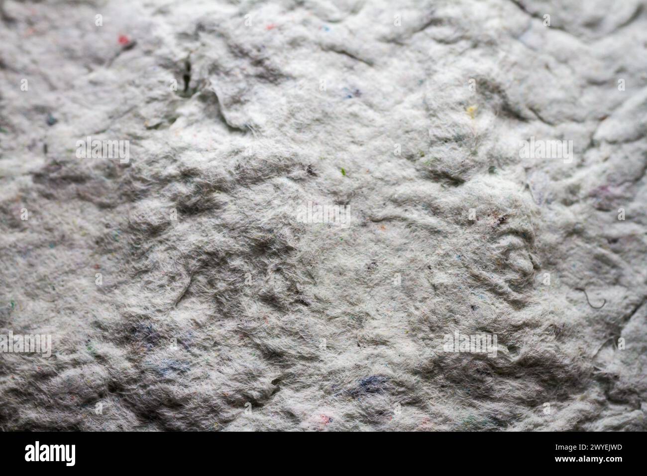 Extreme close up of old gray handmade paper mache with a structure and ...