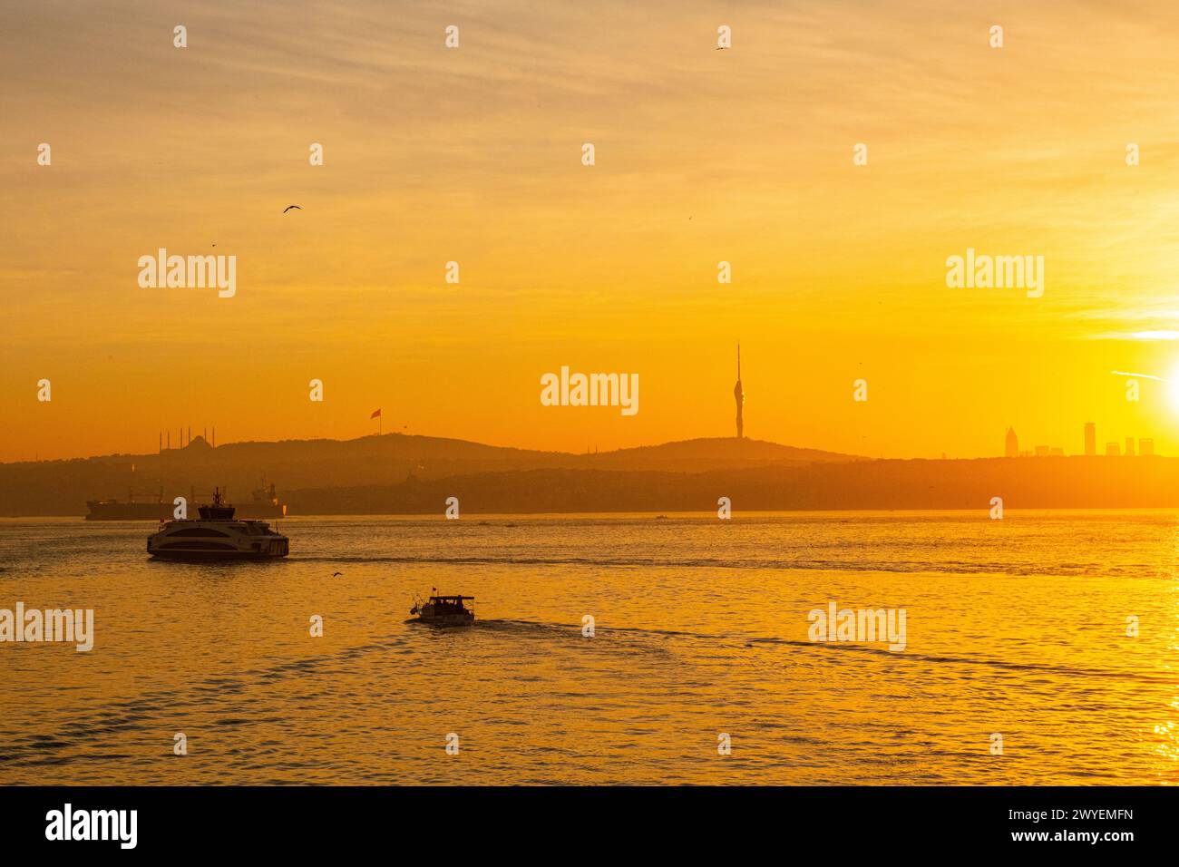 Sunrise in Istanbul at the Galata Bridge, Turkey with the Camlica Tower ...