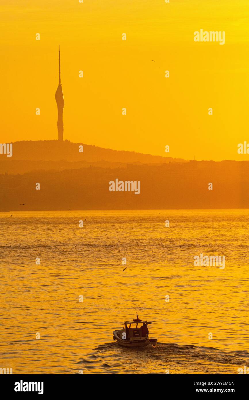 Sunrise in Istanbul at the Galata Bridge, Turkey with the Camlica Tower ...