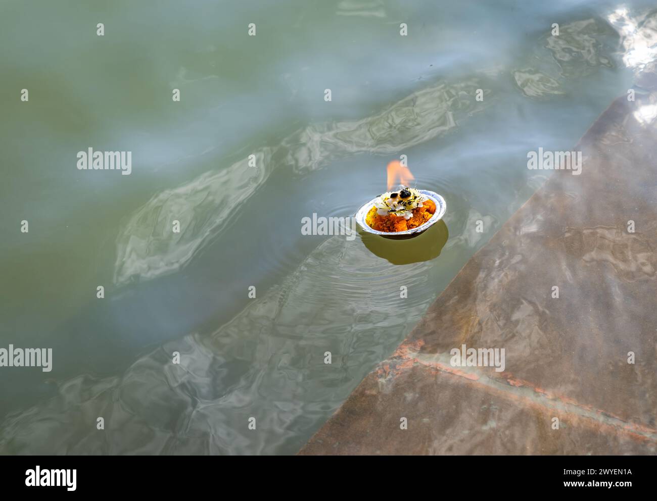 holy offerings oil lamp at river shore on religious occasion at morning ...