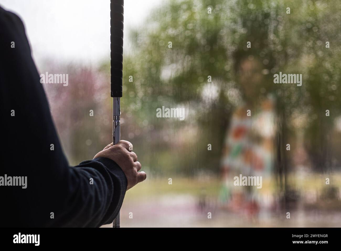 A blind person with a cane on a rainy day, Disability concept Stock ...