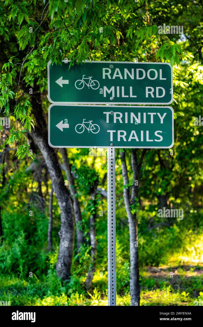 A road sign of bicycle trails against green trees Stock Photo - Alamy