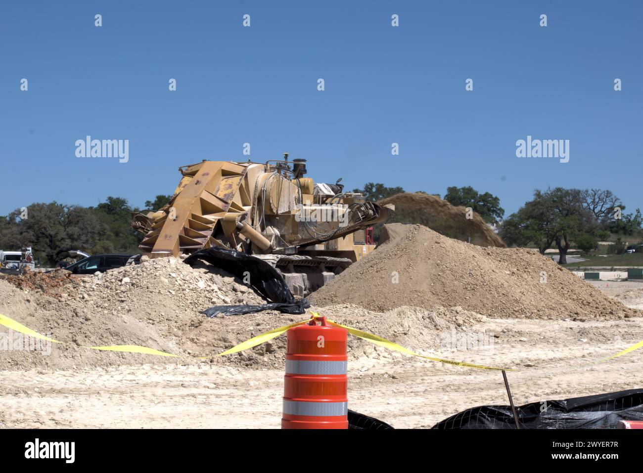 Excavation equipment leveling hills in Texas Hill Country to support ...