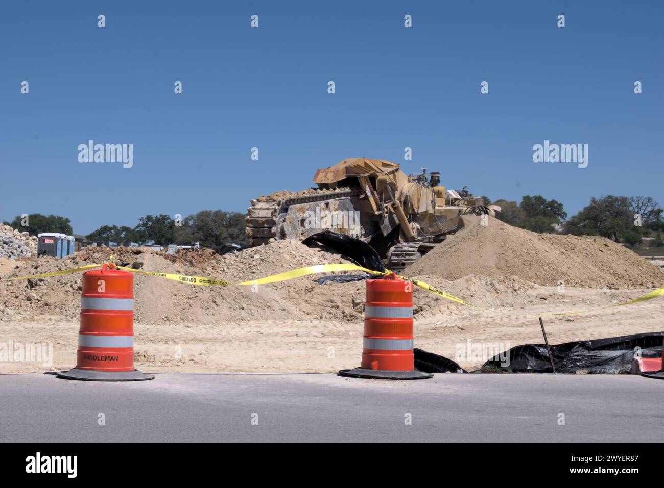 Excavation equipment leveling hills in Texas Hill Country to support ...