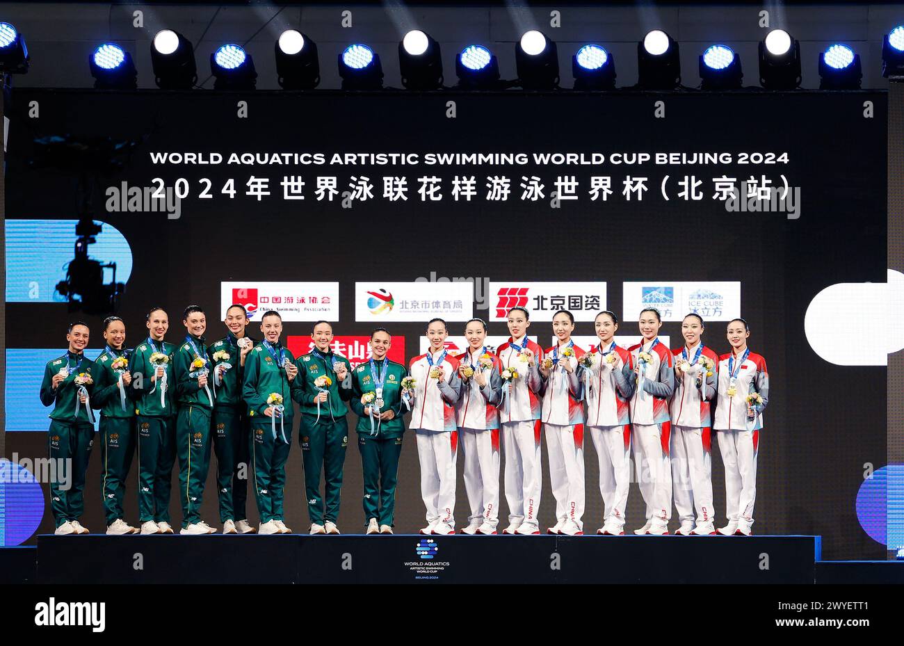 Beijing, China. 6th Apr, 2024. Gold medalists team China (R) and silver medalists team Australia ...