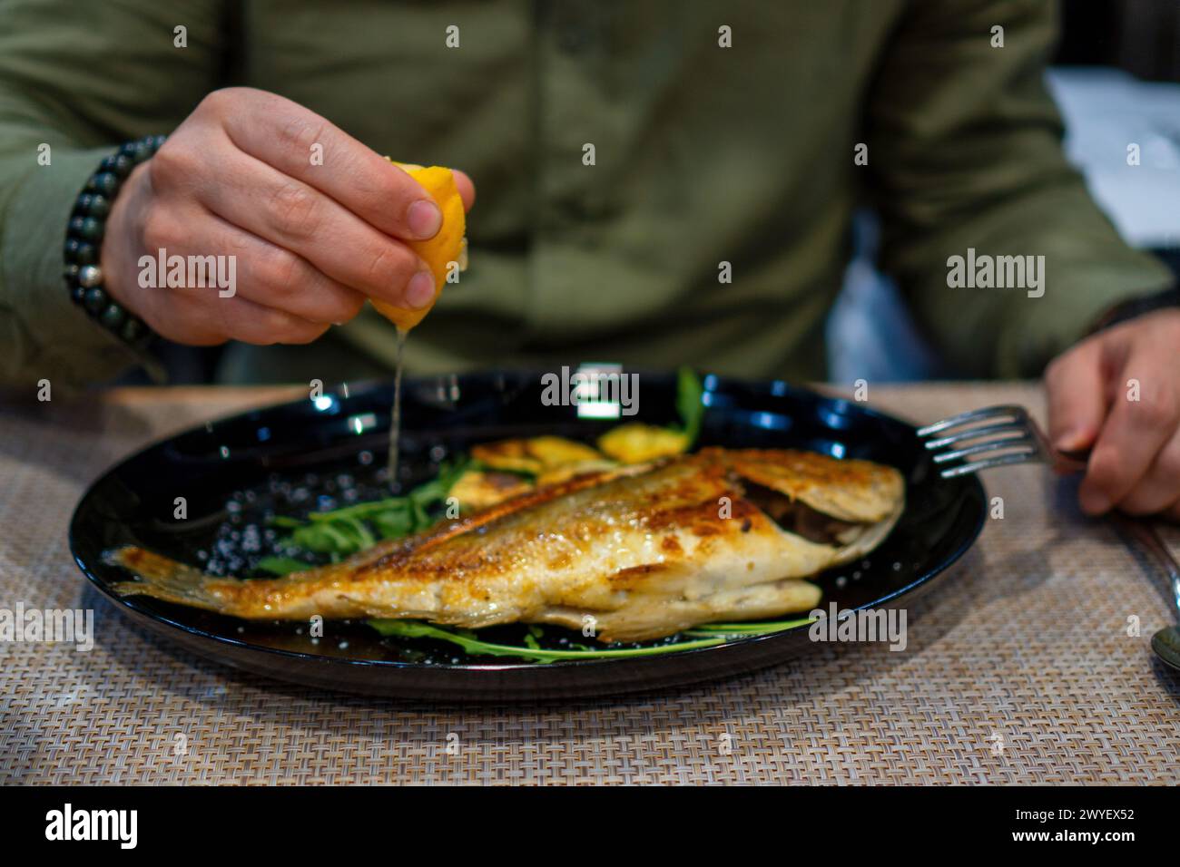 Man fish plate hi-res stock photography and images - Alamy