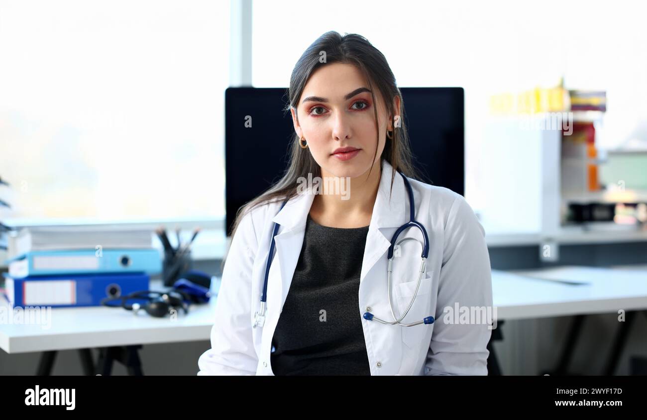 Beautiful smiling female doctor at workplace portrait Stock Photo - Alamy