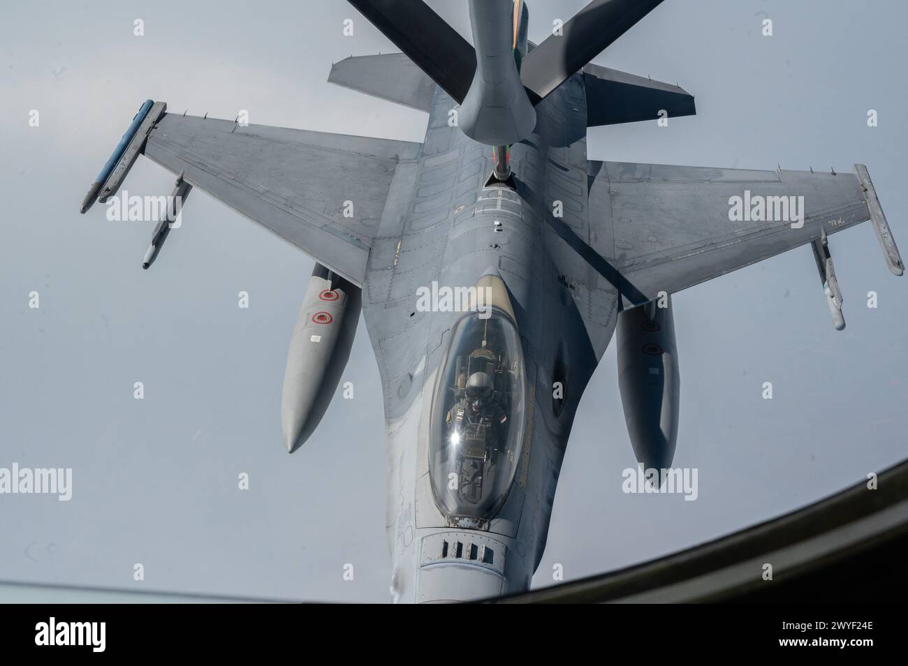 A Republic of Singapore Air Force F-16 gets refueled by a Washington ...