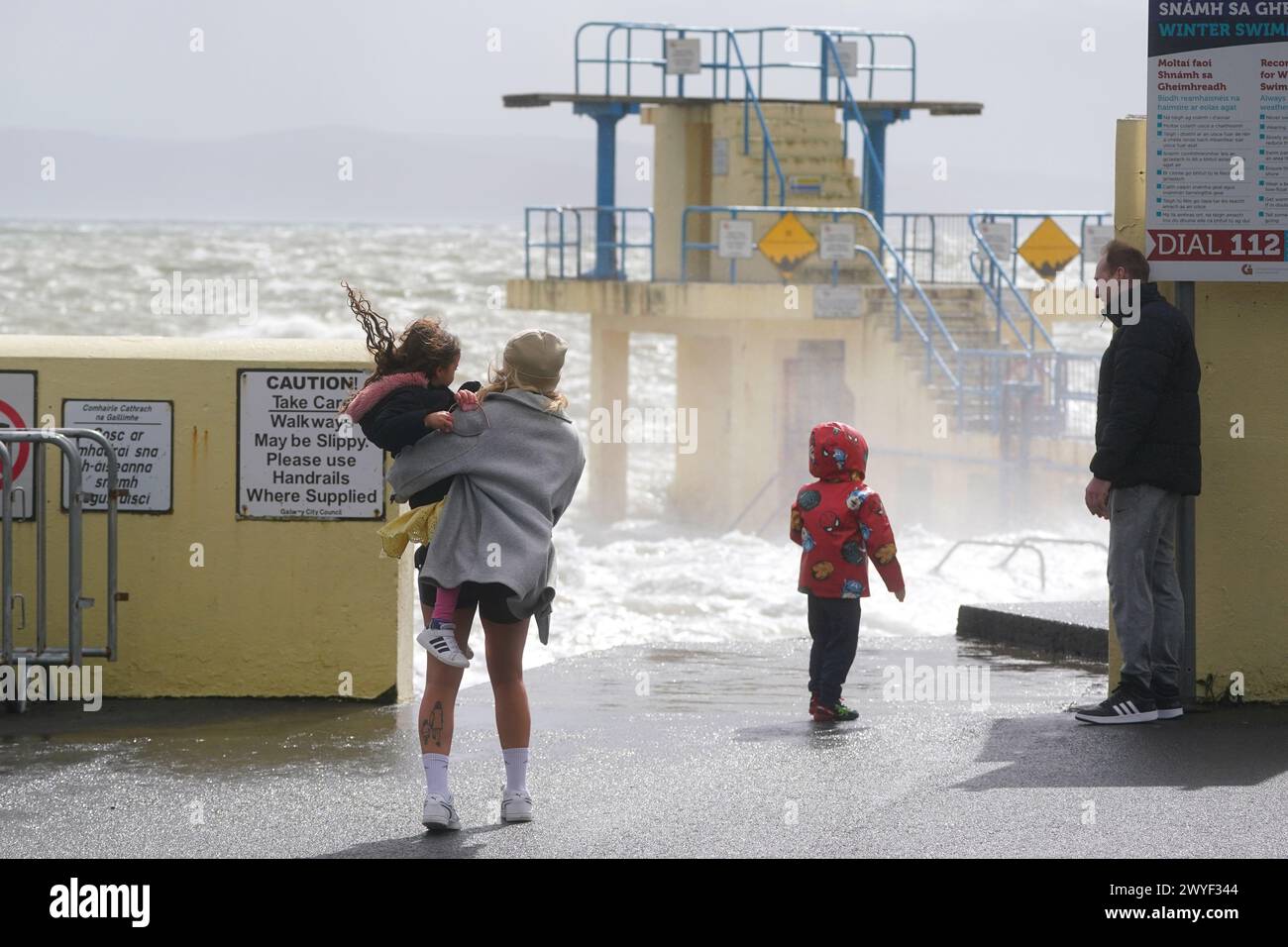 People look at the waves at Blackrock Diving Board, Salthill, Co ...