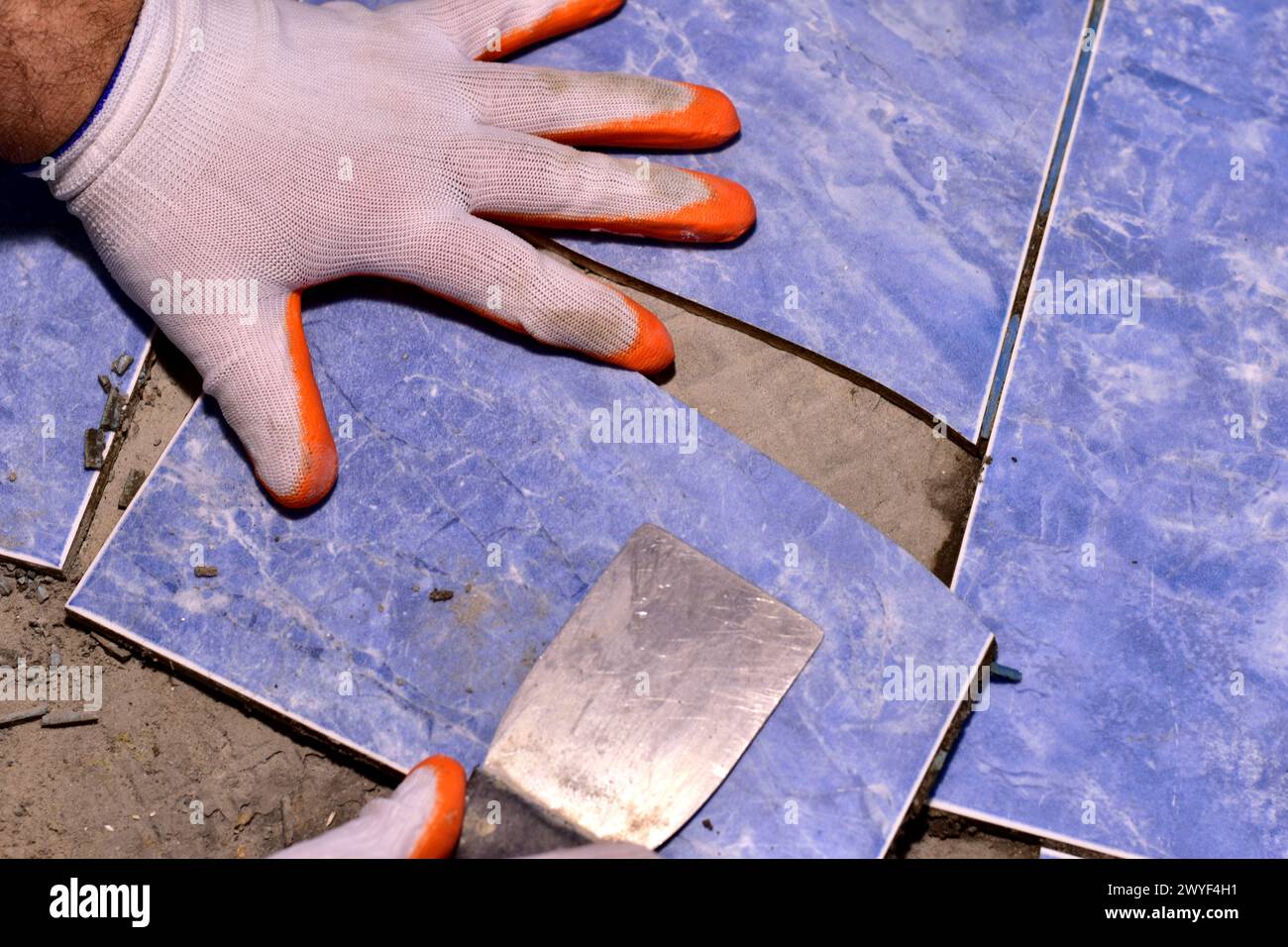 Renovation construction builder laying ceramic hi-res stock photography ...