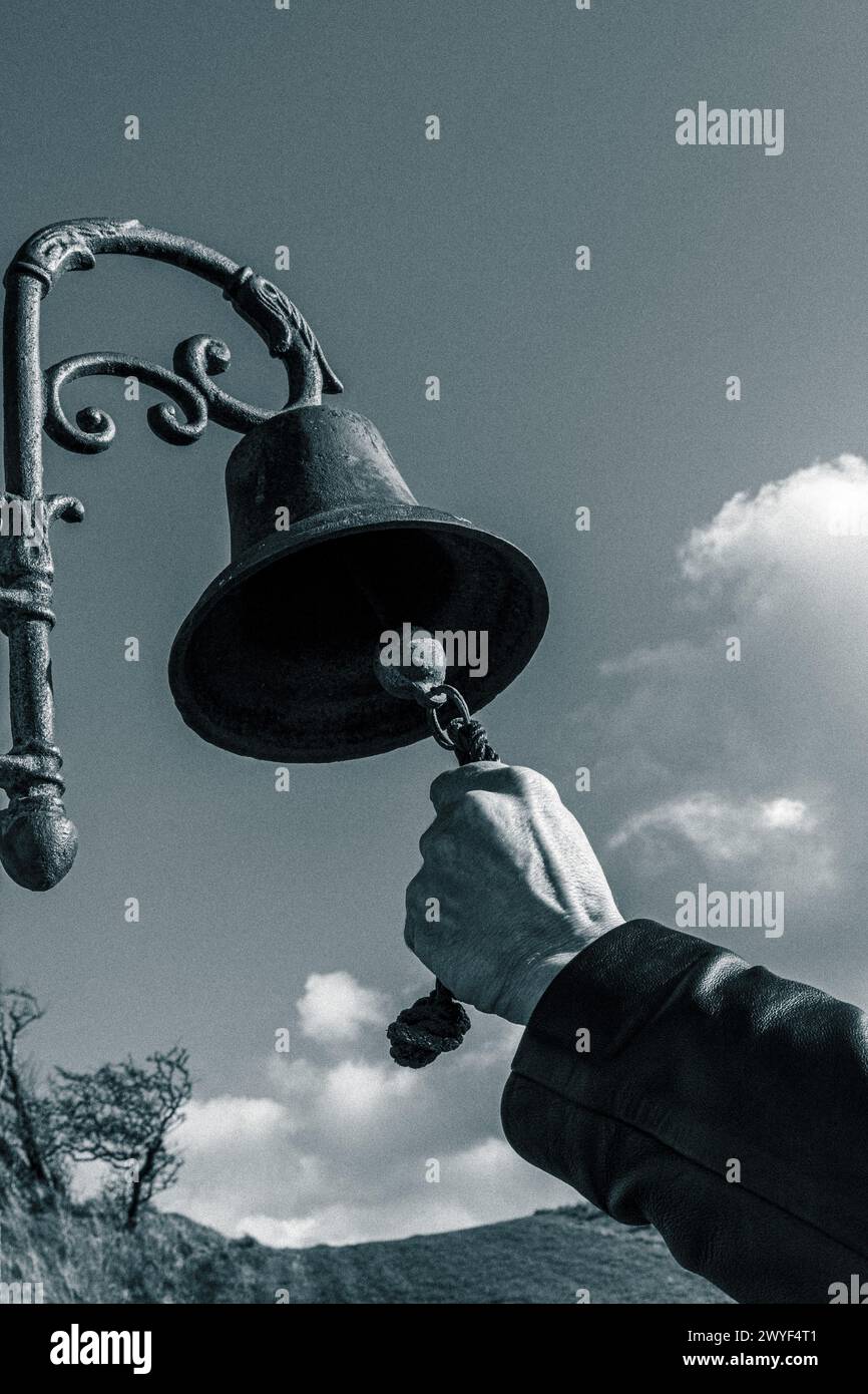 Male hand ringing bell Stock Photo - Alamy