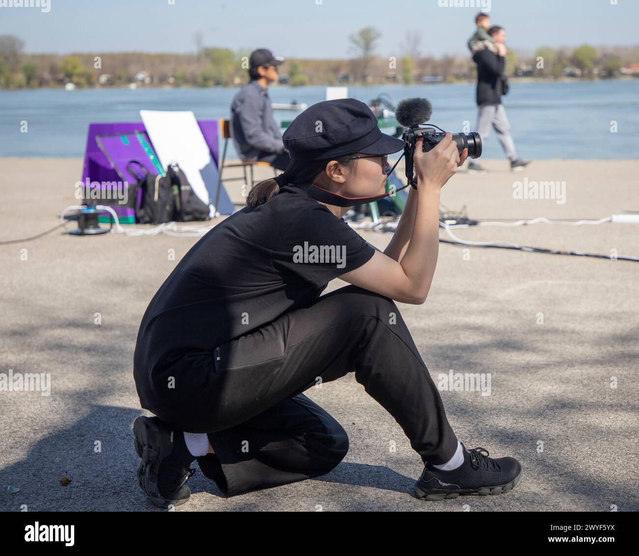 Zemun, Serbia, March 23, 2024: Young woman photographer capturing a ...