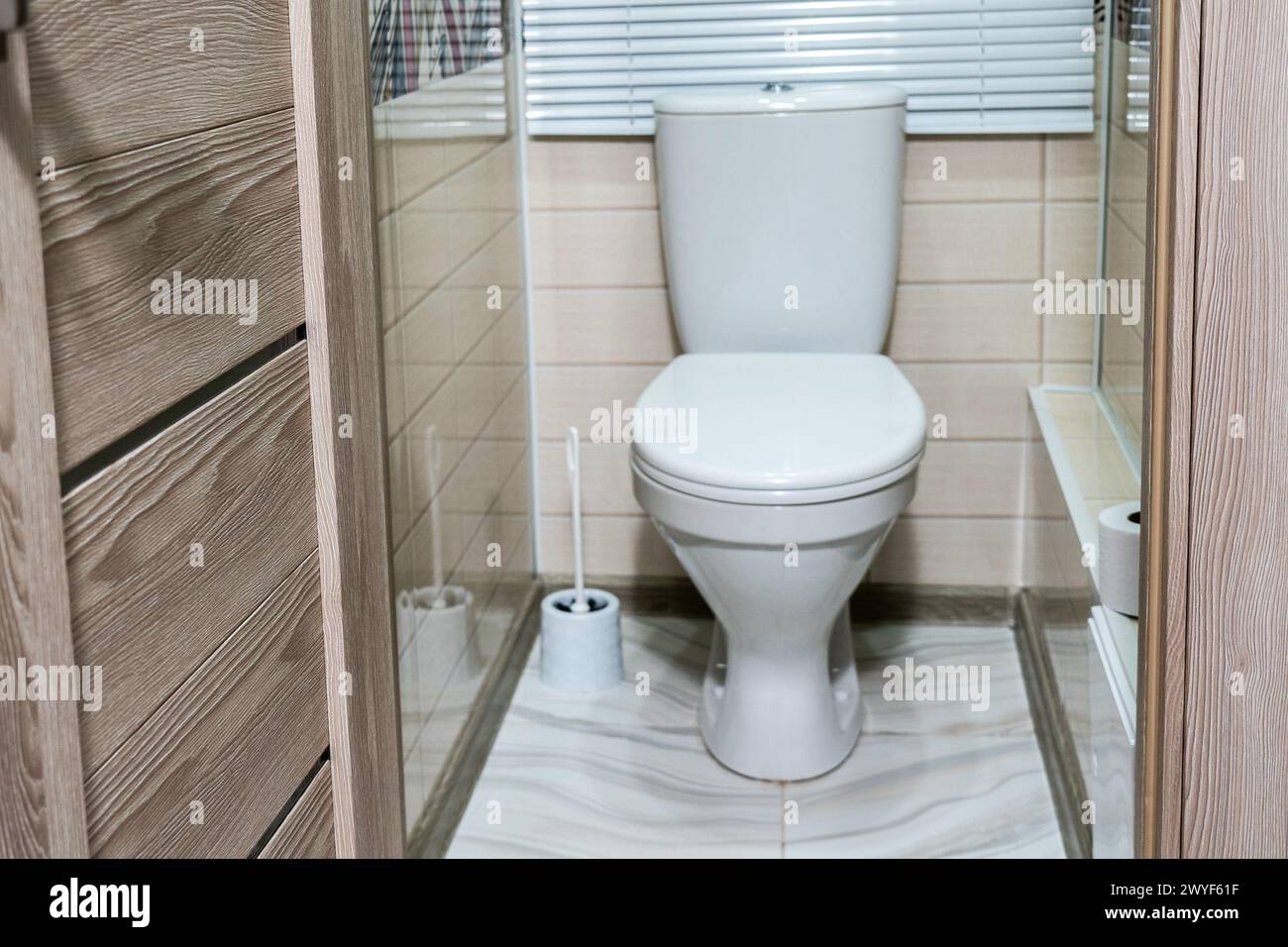 White toilet in a separate small toilet room Stock Photo - Alamy