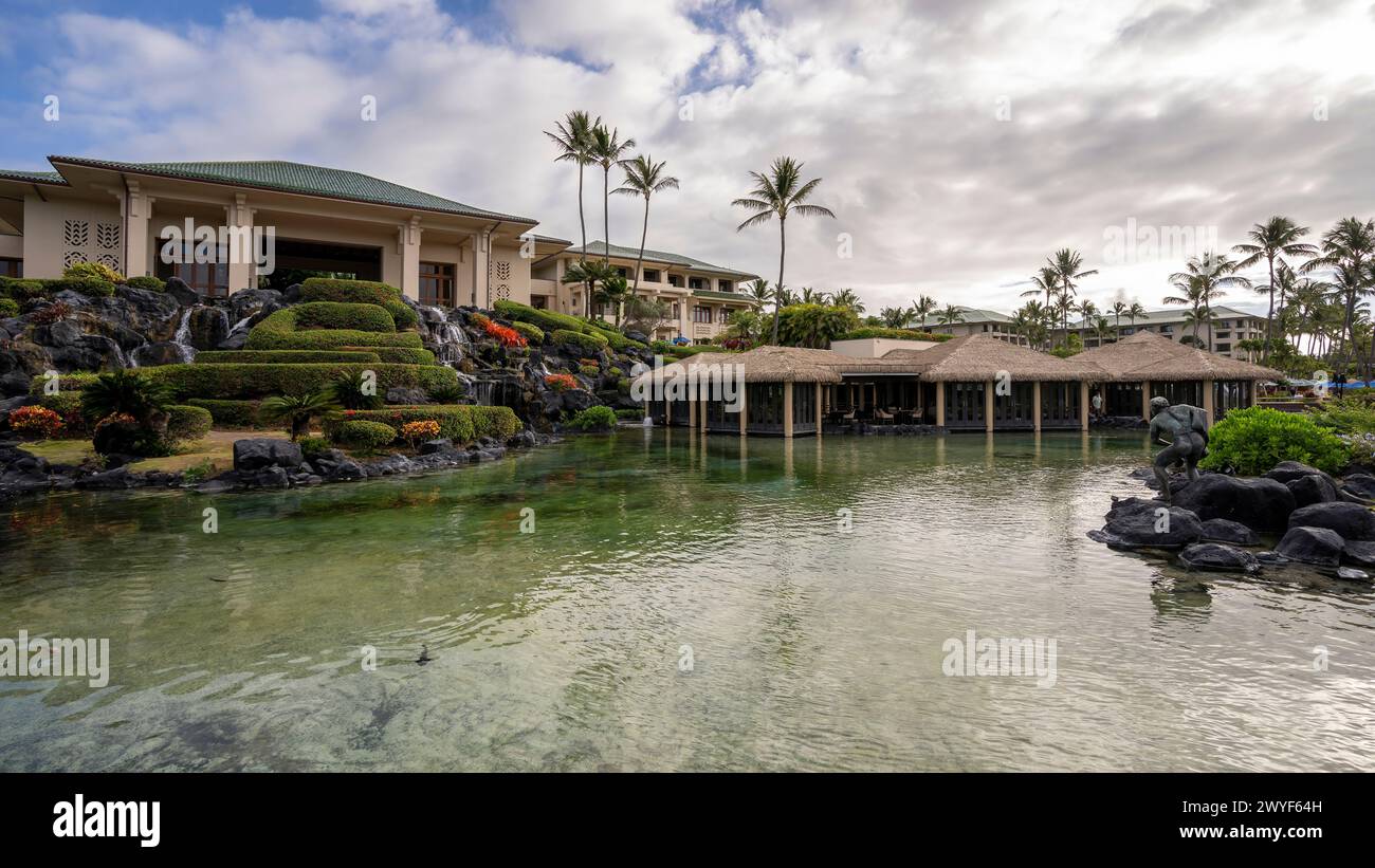 Pond outside the beautiful facade of the Grand Hyatt Kauai Resort and ...