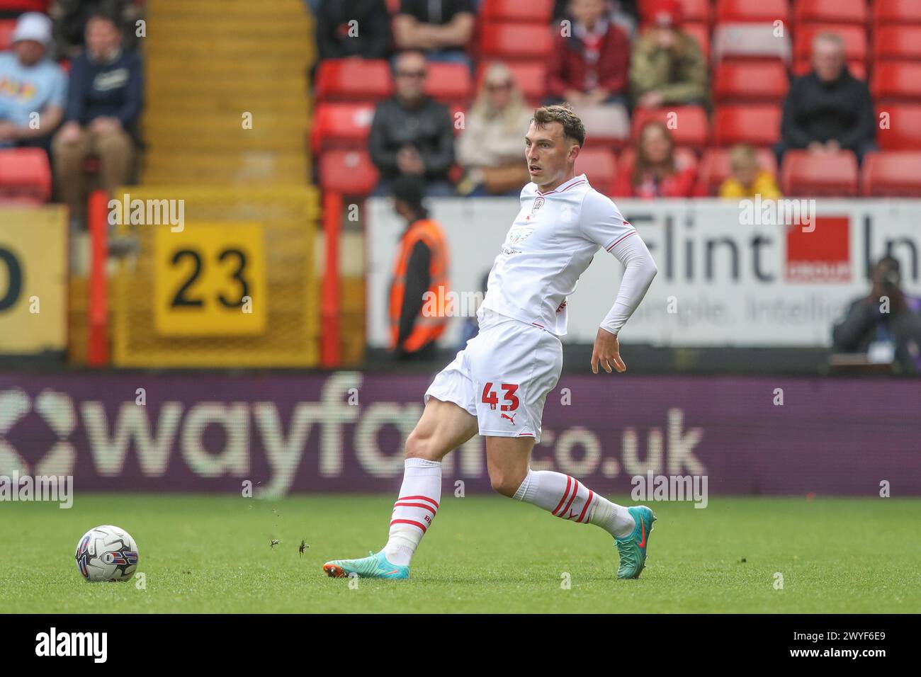 London, UK. 06th Apr, 2024. Josh Earl of Barnsley passes the ball ...