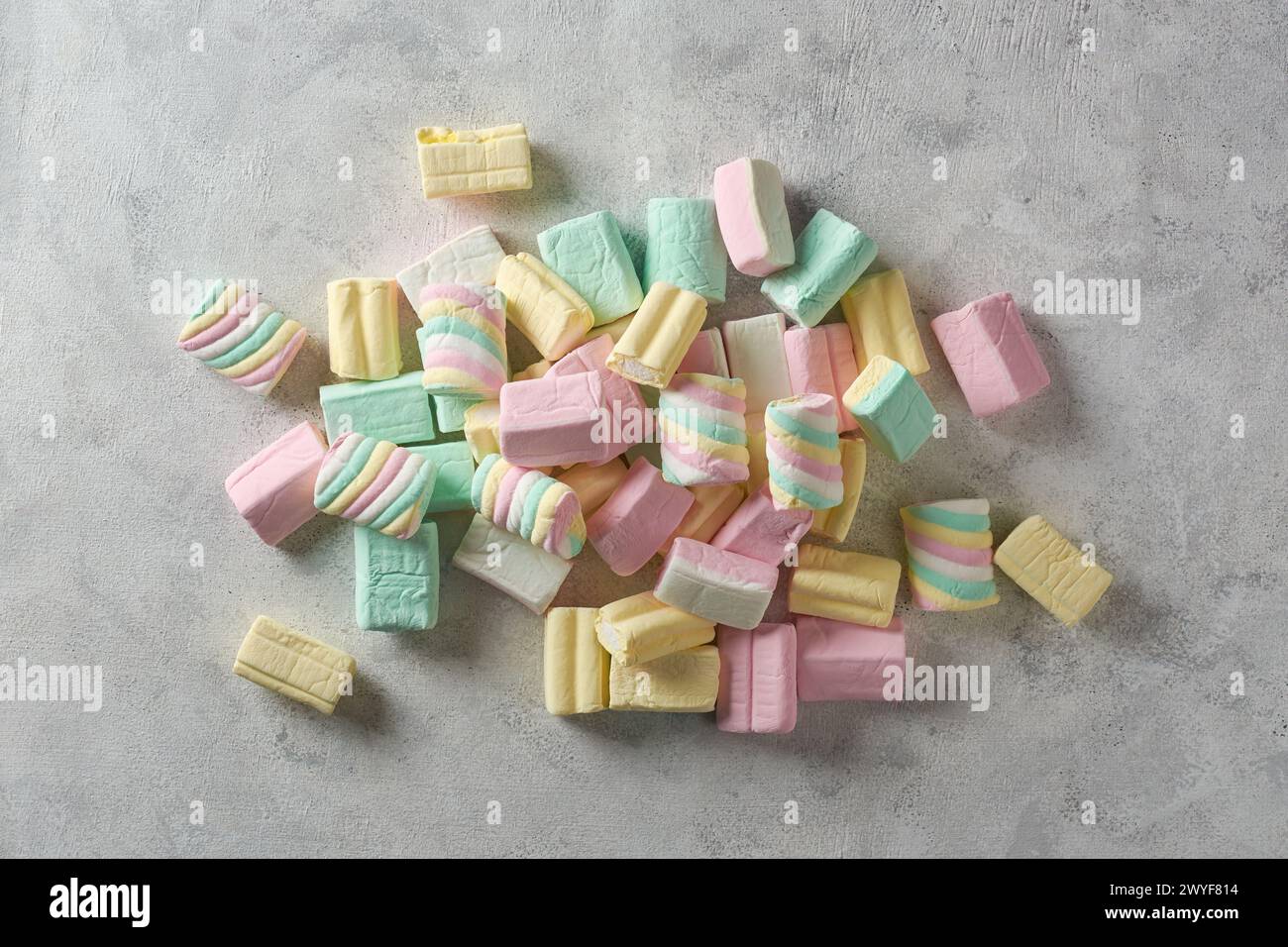 marshmallows on white textured surface, colorful fluffy soft sugar ...