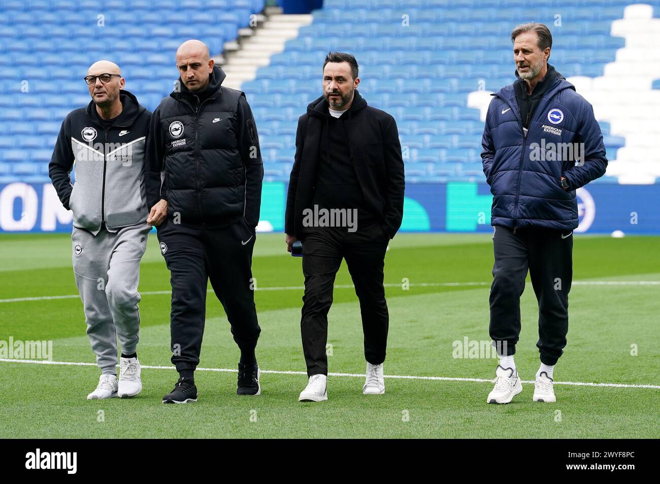 Brighton and Hove Albion manager Roberto De Zerbi (second right) ahead ...