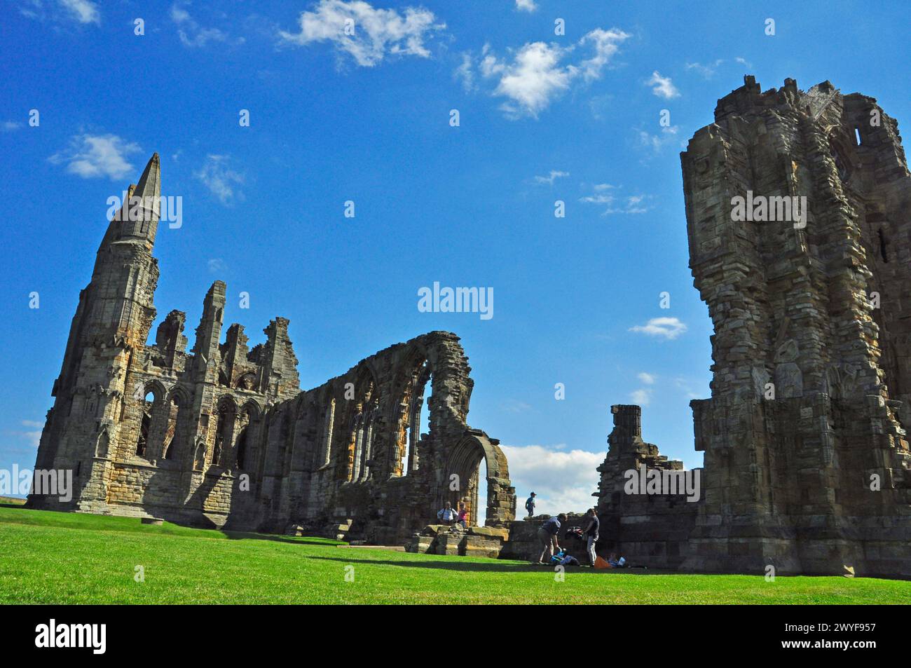 Holidaymakers enjoying the summer sunshine at Whitby Abbey.Whitby Abbey ...