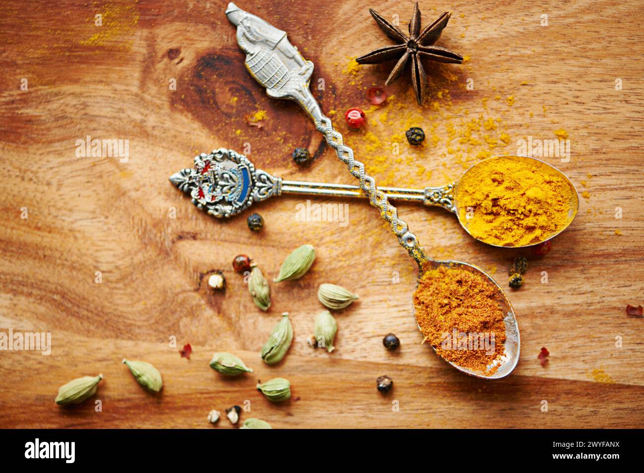 Spoons, spice and selection of seasoning for health on kitchen table ...