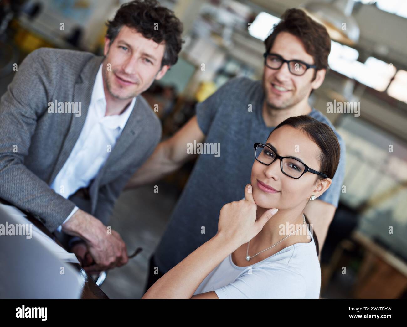 Team, laptop and portrait in office for thinking, planning and vision ...