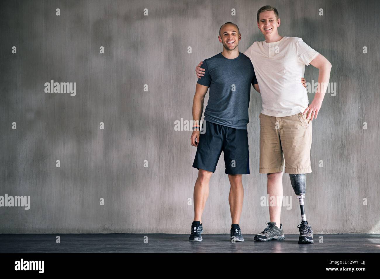 happy, physiotherapist and man with disability in portrait with ...