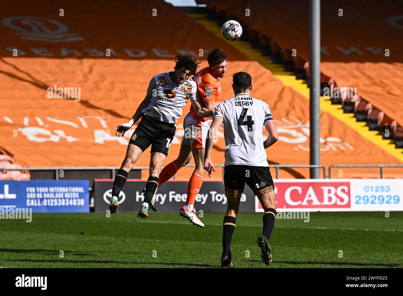 Matthew Pennington of Blackpool wins the header during the Sky Bet ...