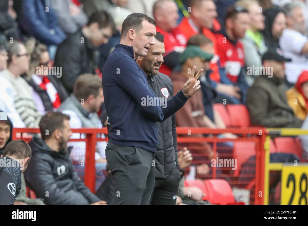 Neill Collins Head coach of Barnsley speaks to Martin Devaney first ...
