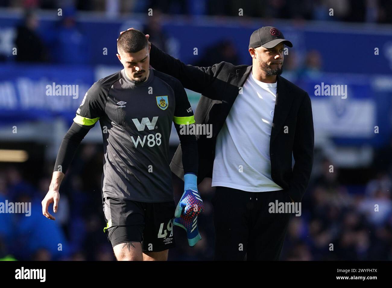 Burnley manager Vincent Kompany (right) with goalkeeper Arijanet Muric ...