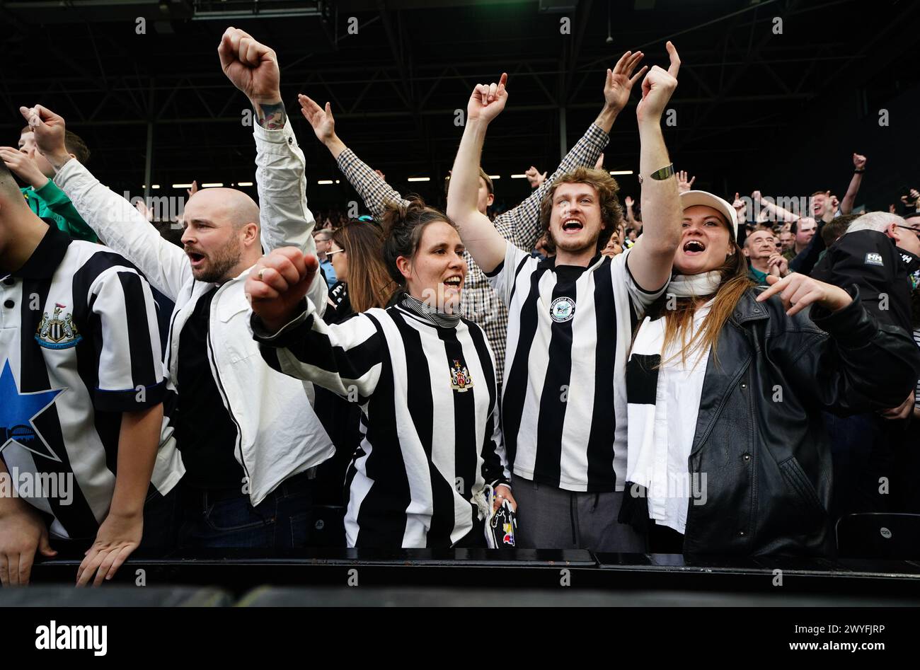 Newcastle United fans celebrate the win in the stands after the Premier ...