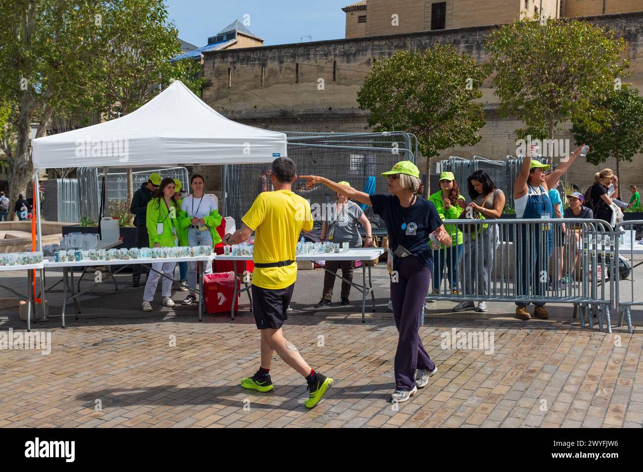 Montpellier, France. 6th Apr 2024. Volunteers helping runners at a ...