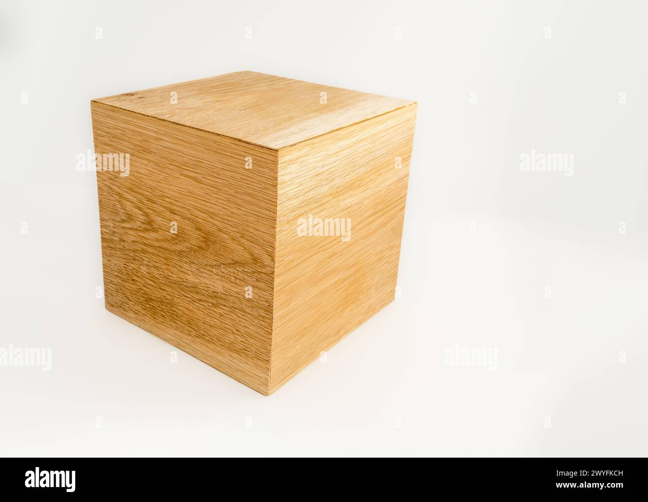 large cube of european oak wood isolated on a white background Stock ...