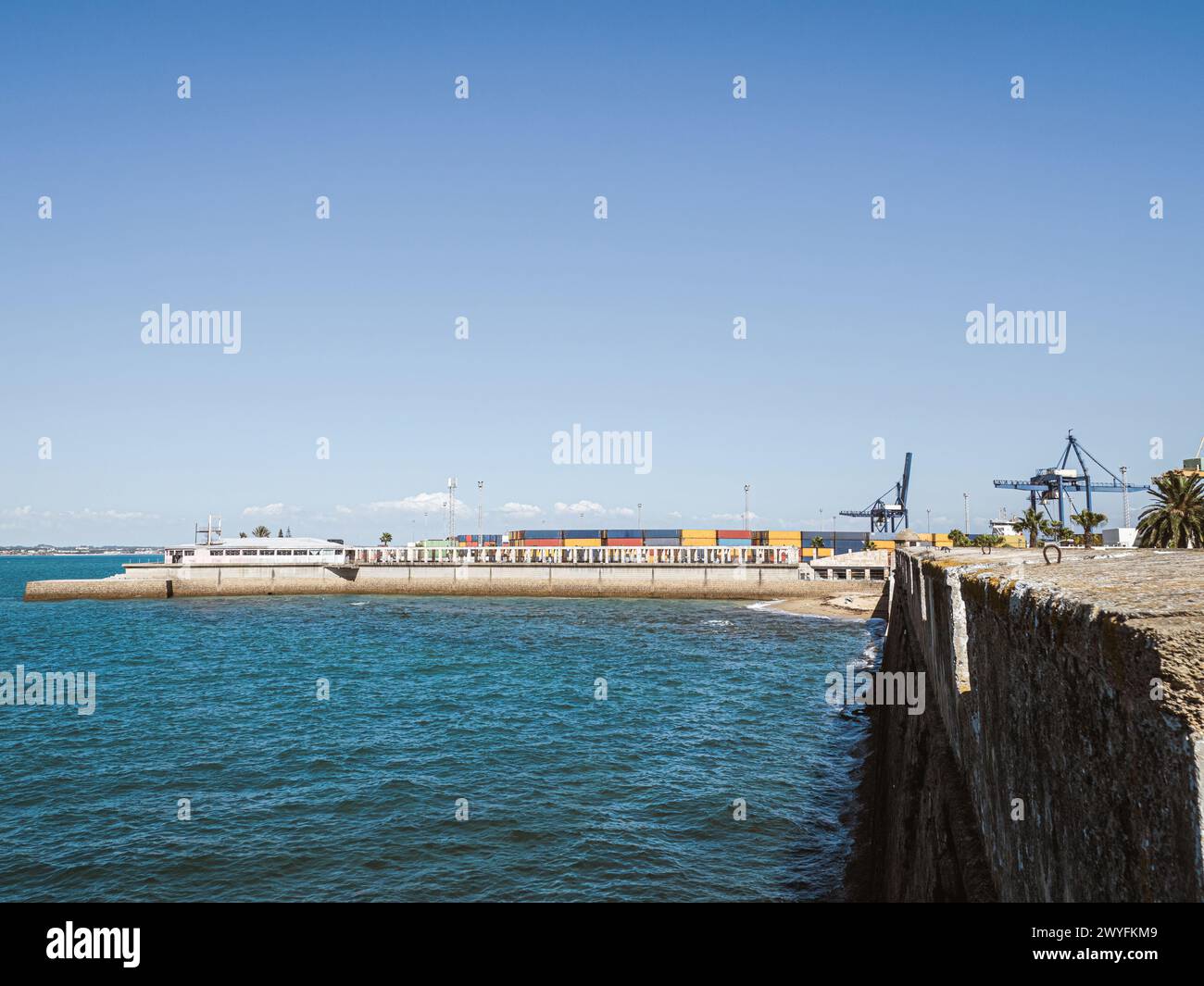 View of the cargo port of Cadiz, Spain, with colorful containers ...