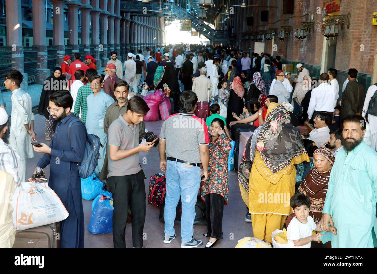 A large numbers of people gather for boarding on special Eid train as ...