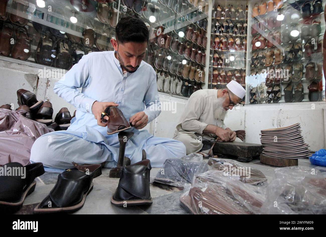 Shoemakers preparing shoes for customers to wear on Eid- ul- Fitar at ...