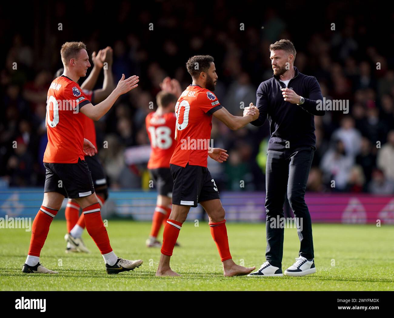 Luton Town manager Rob Edwards (right) congratulates Andros Townsend ...