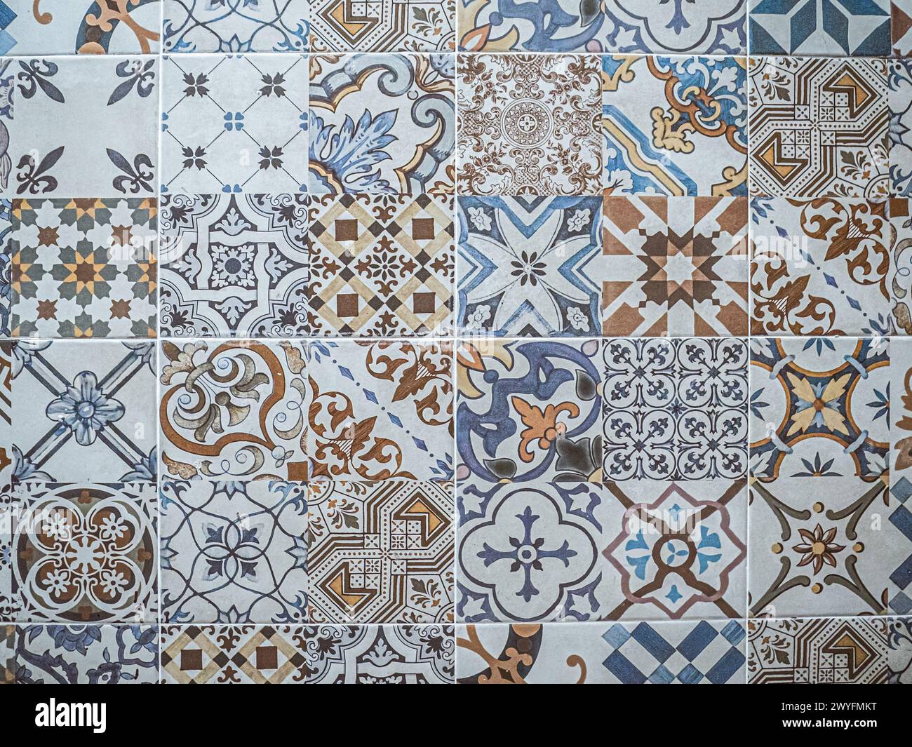 A pattern made of traditional colorful floral Spanish tiles on a marble ...