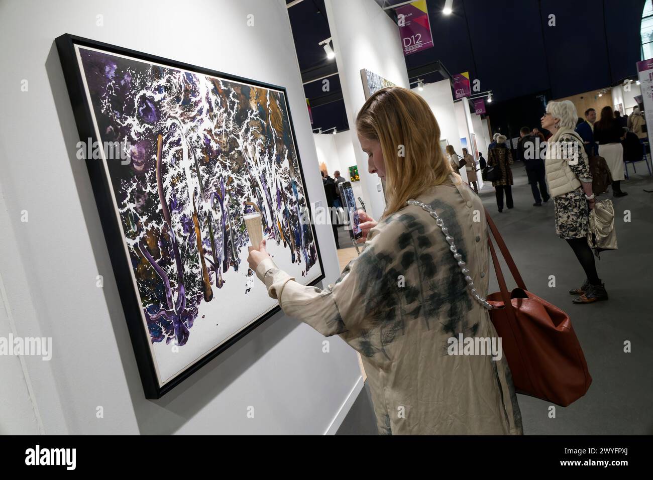 Paris, France. 5th Apr, 2024. Visitor looking at a painting during the ...