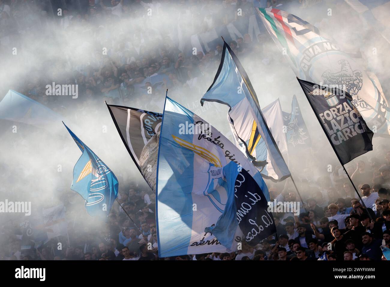 Rome, Lazio, Italy. 6th Apr, 2024. Lazio's fans wave flags during Serie ...