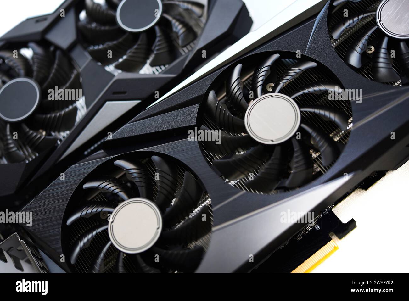 A black and white video card on a white background. Fans and the ...