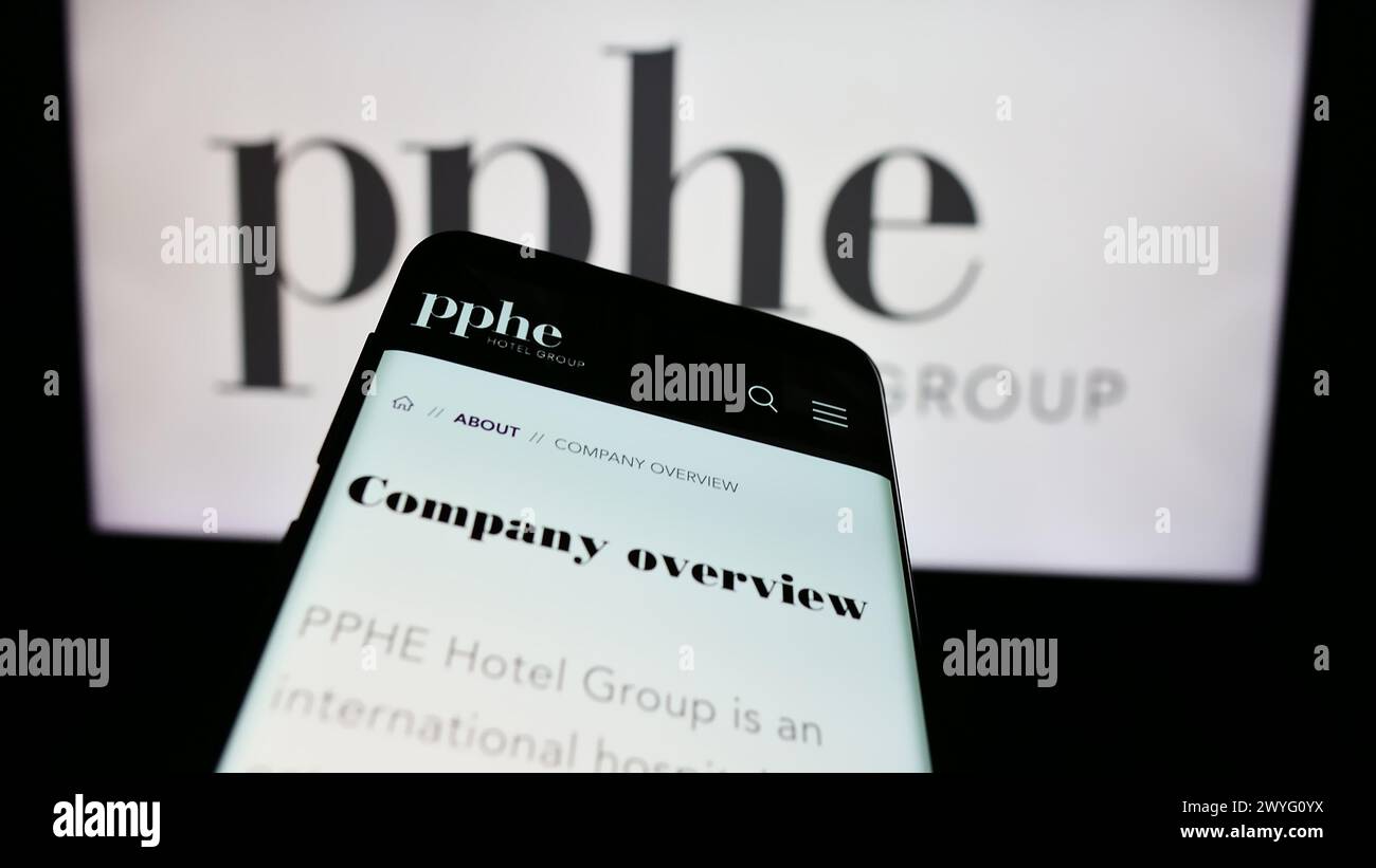 Mobile phone with website of British hospitality company PPHE Hotel ...