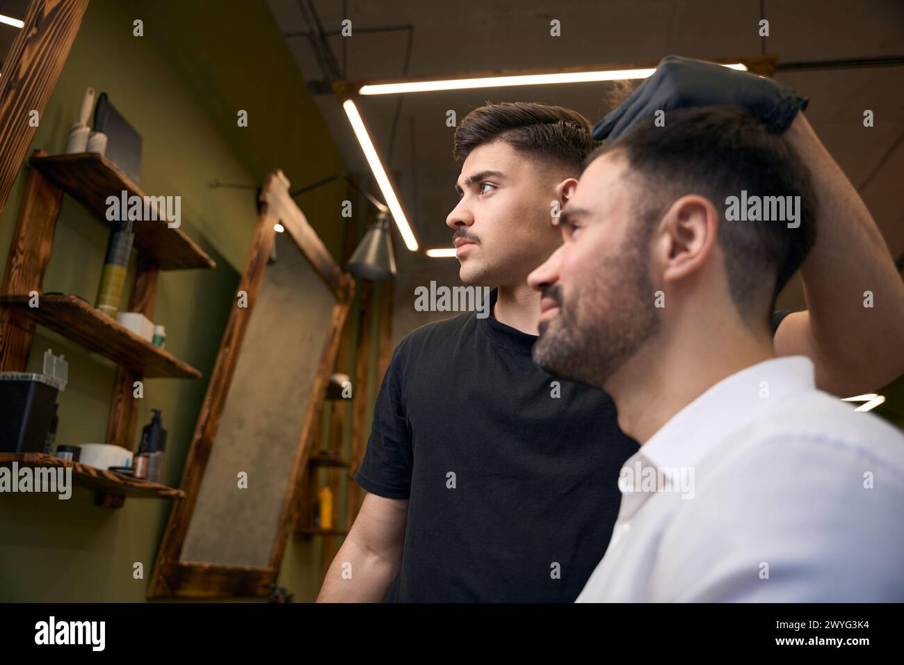 Man getting hair styled hi-res stock photography and images - Alamy
