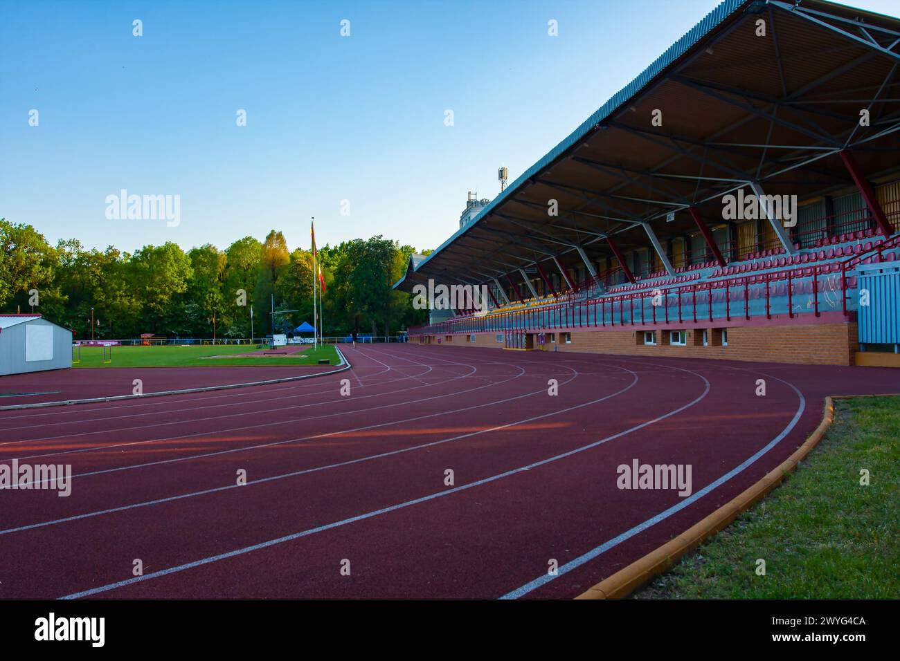 Sports stadium, a red athletic treadmill with a designated track for ...