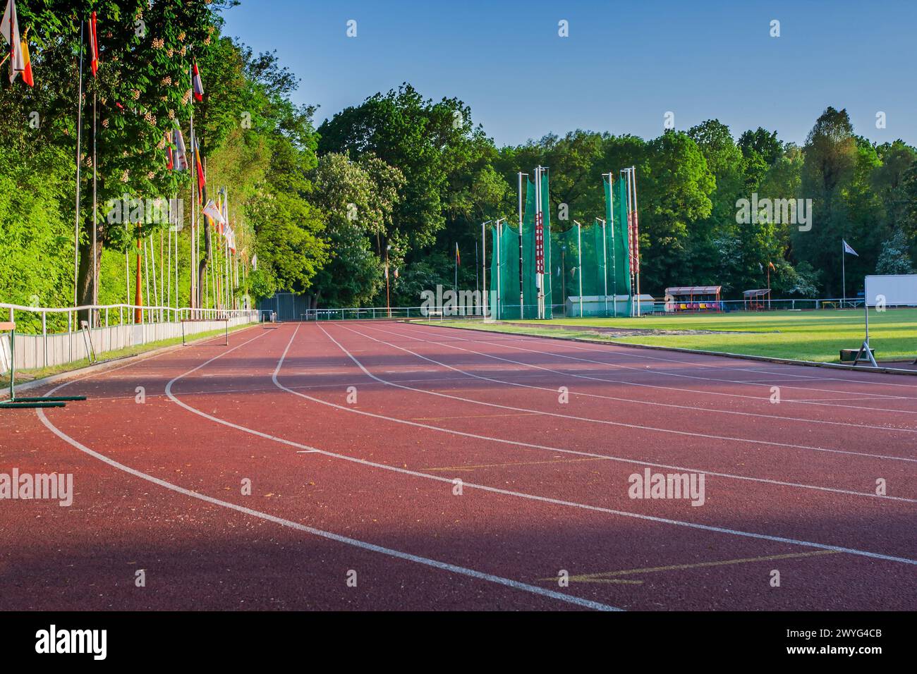 Sports stadium, a red athletic treadmill with a designated track for ...