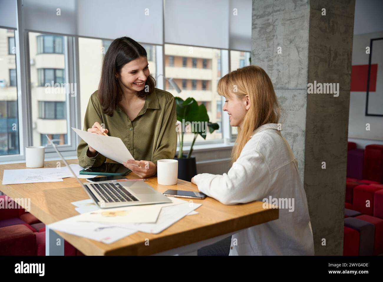 Women designers collaborating on digital fashion project Stock Photo ...