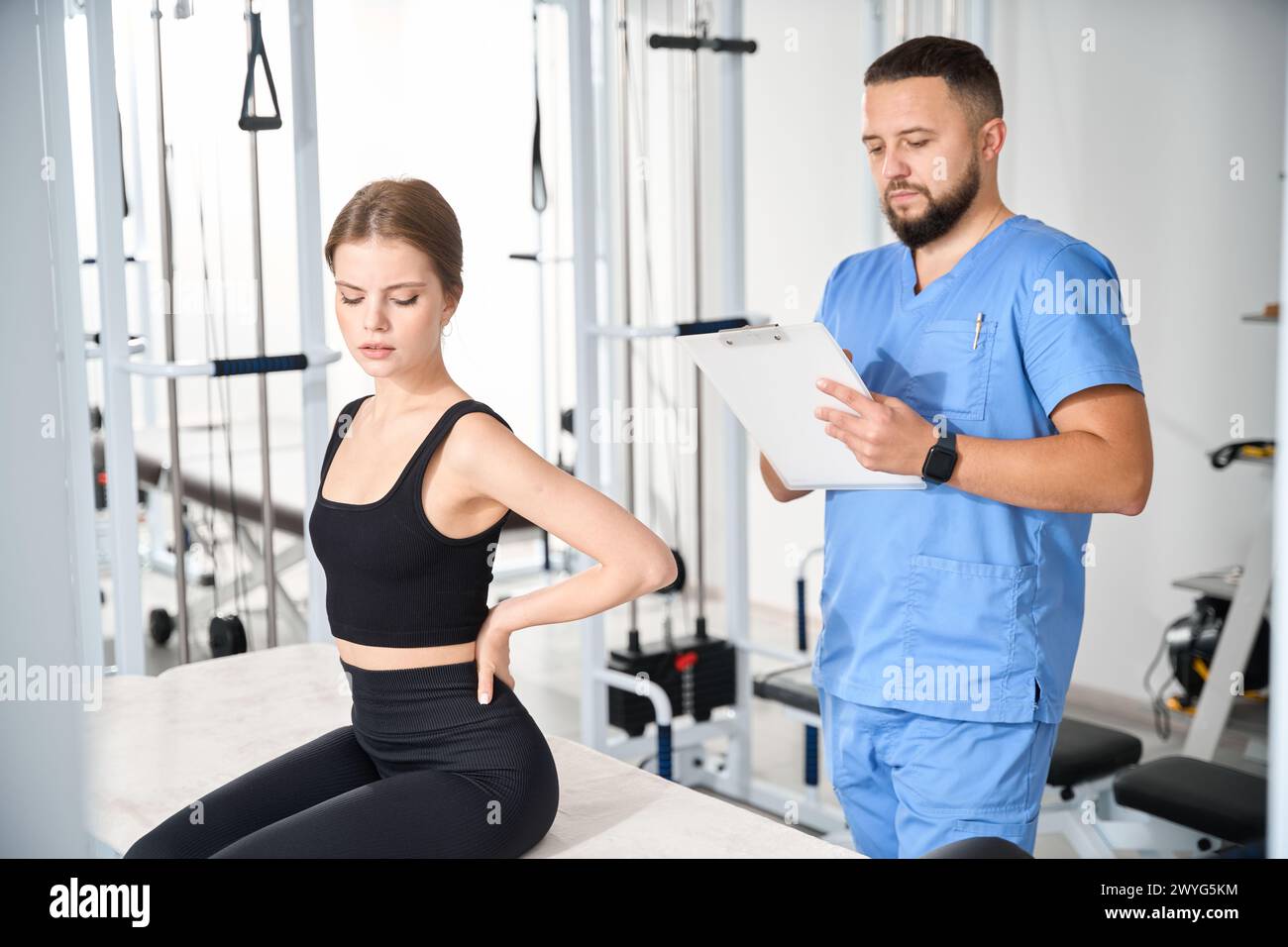 Doctor questioning young male hi-res stock photography and images - Alamy