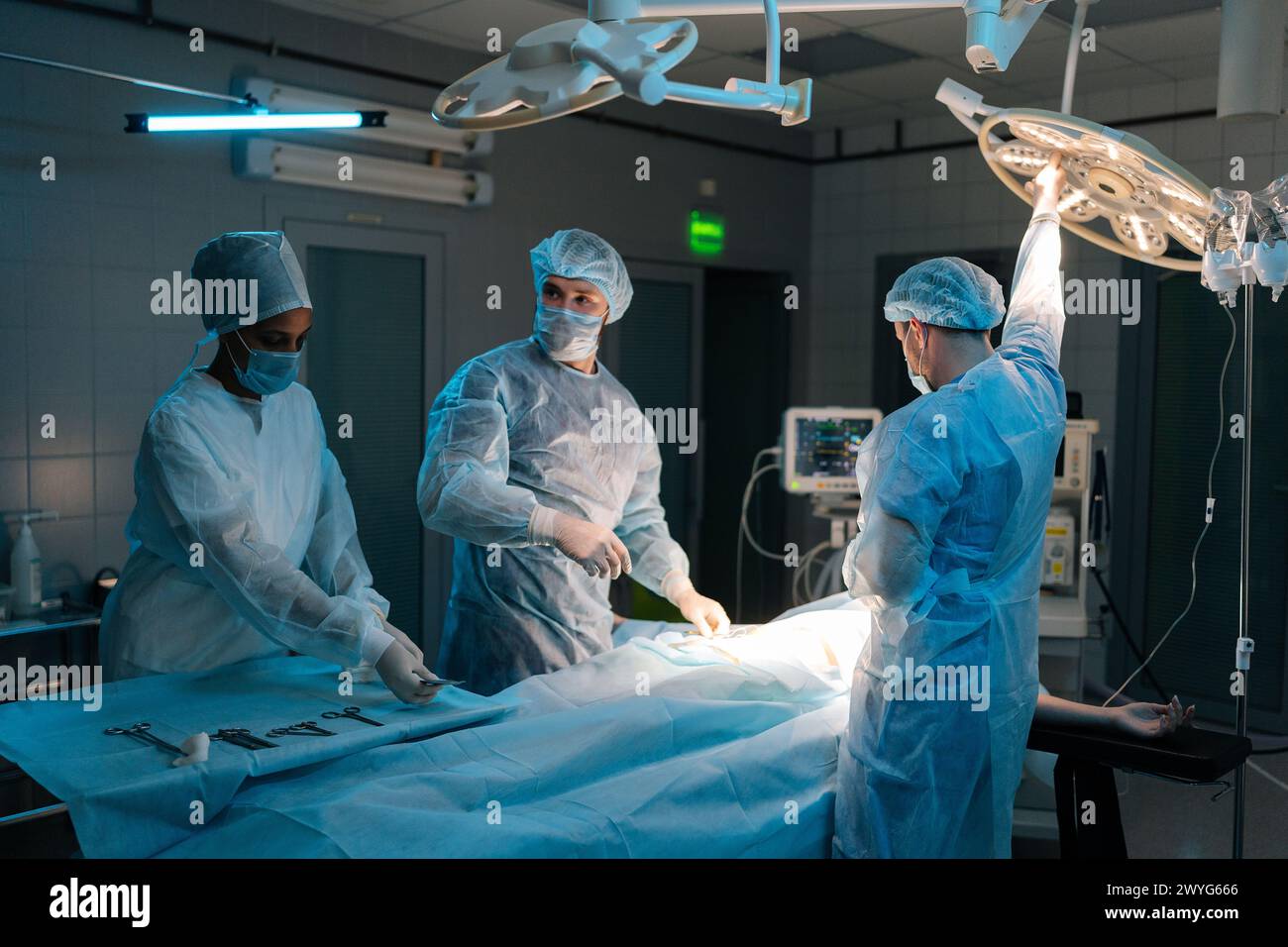 Diverse female surgeon adjusting hi-res stock photography and images ...