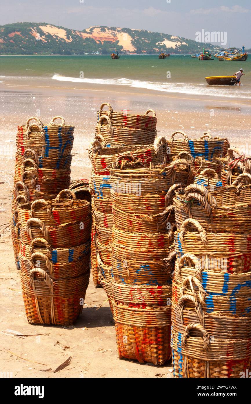 Stacks of wicker baskets on the beach at the fish market in Mui Ne in ...
