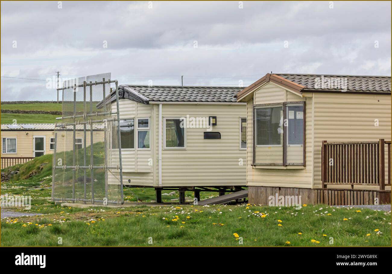 Metal screen erected in front of a holiday home window on the edge of ...