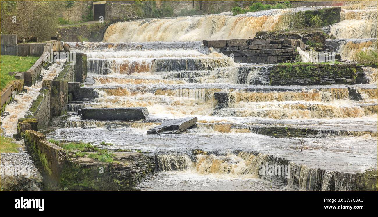 Waterfalls in flood with a salmon run built alongside Stock Photo - Alamy
